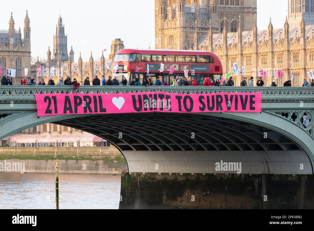 Extinction Rebellion activists perform a banner drop on Westminster ...