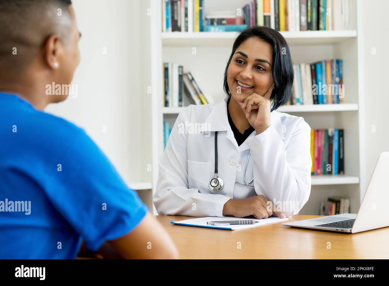 Mexican doctor talking patient hi-res stock photography and images - Alamy