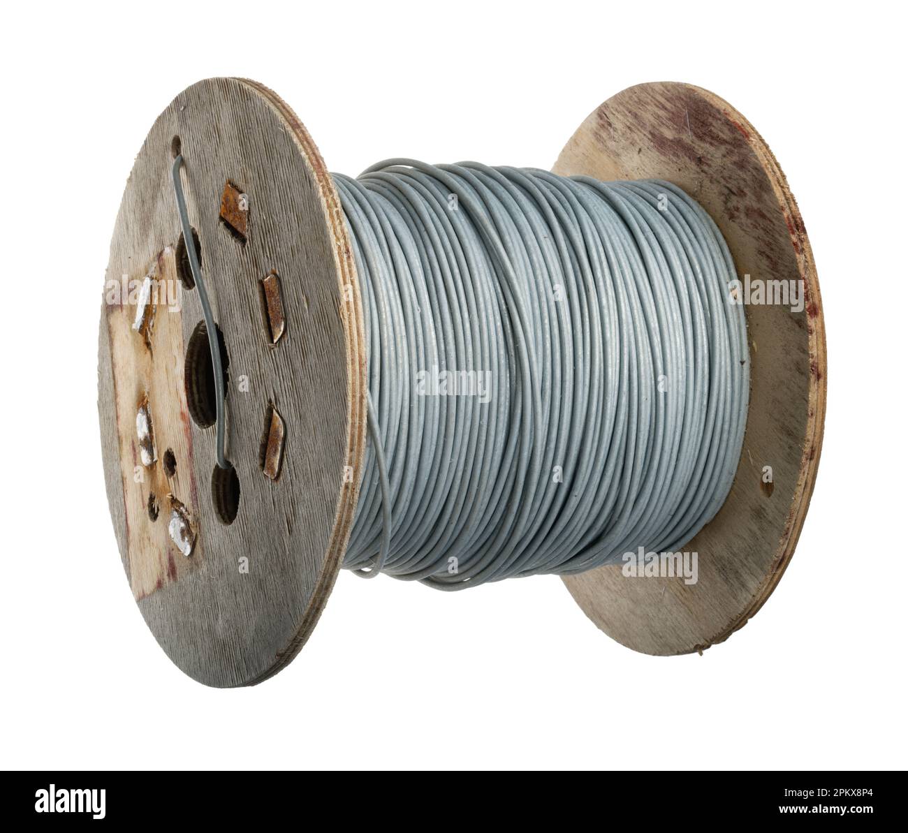 A coil of fence wire. Thick gauge galvanised metal wire. Stock fencing ...