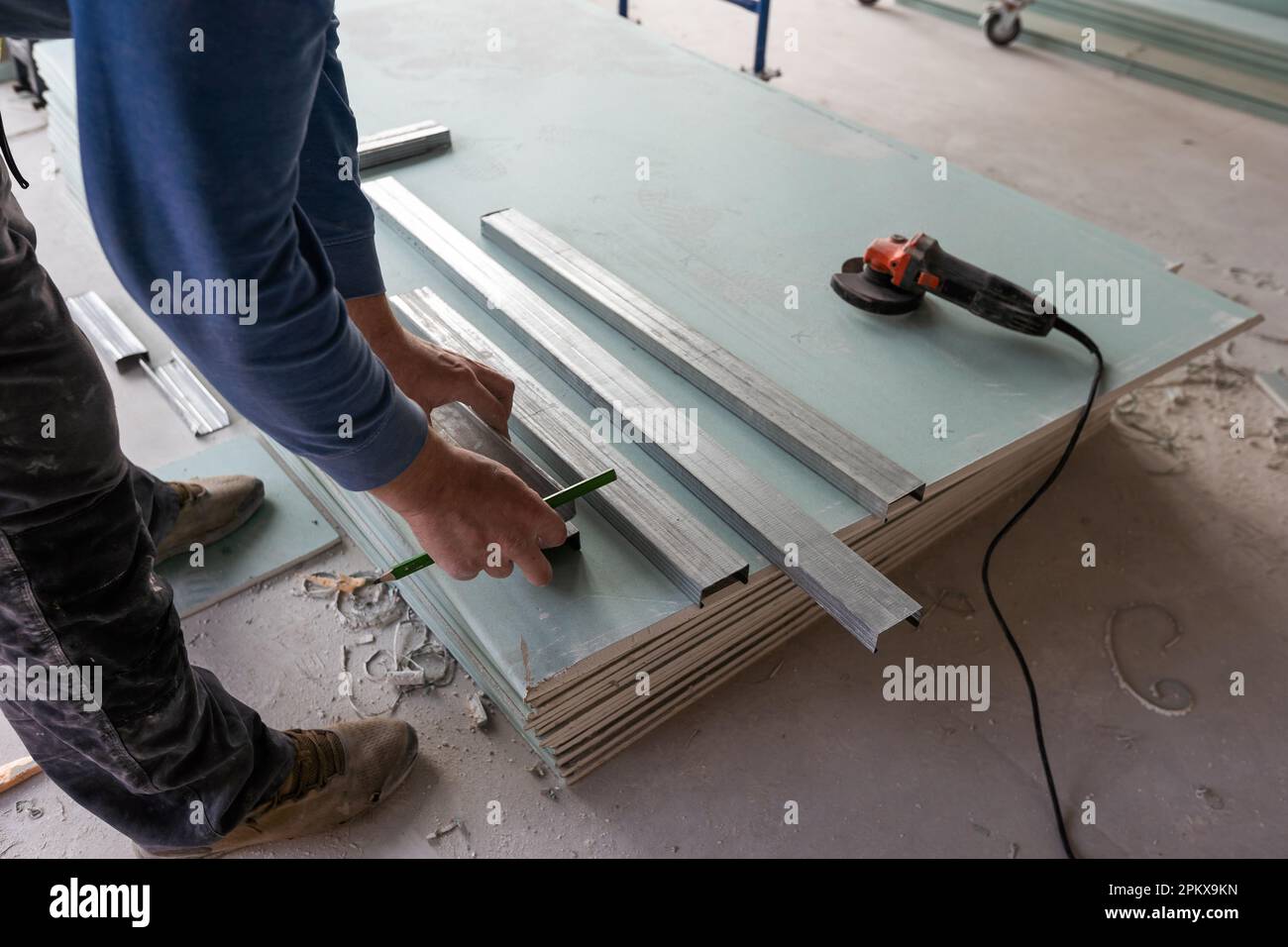 Construction worker installation ceiling work Stock Photo - Alamy