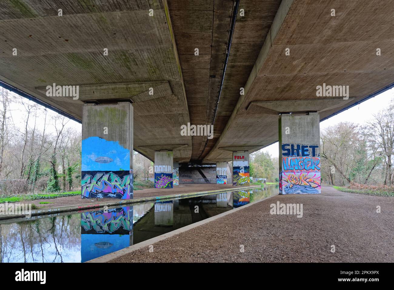 Graffiti painted onto columns supporting the M25 bridge carrying it ...
