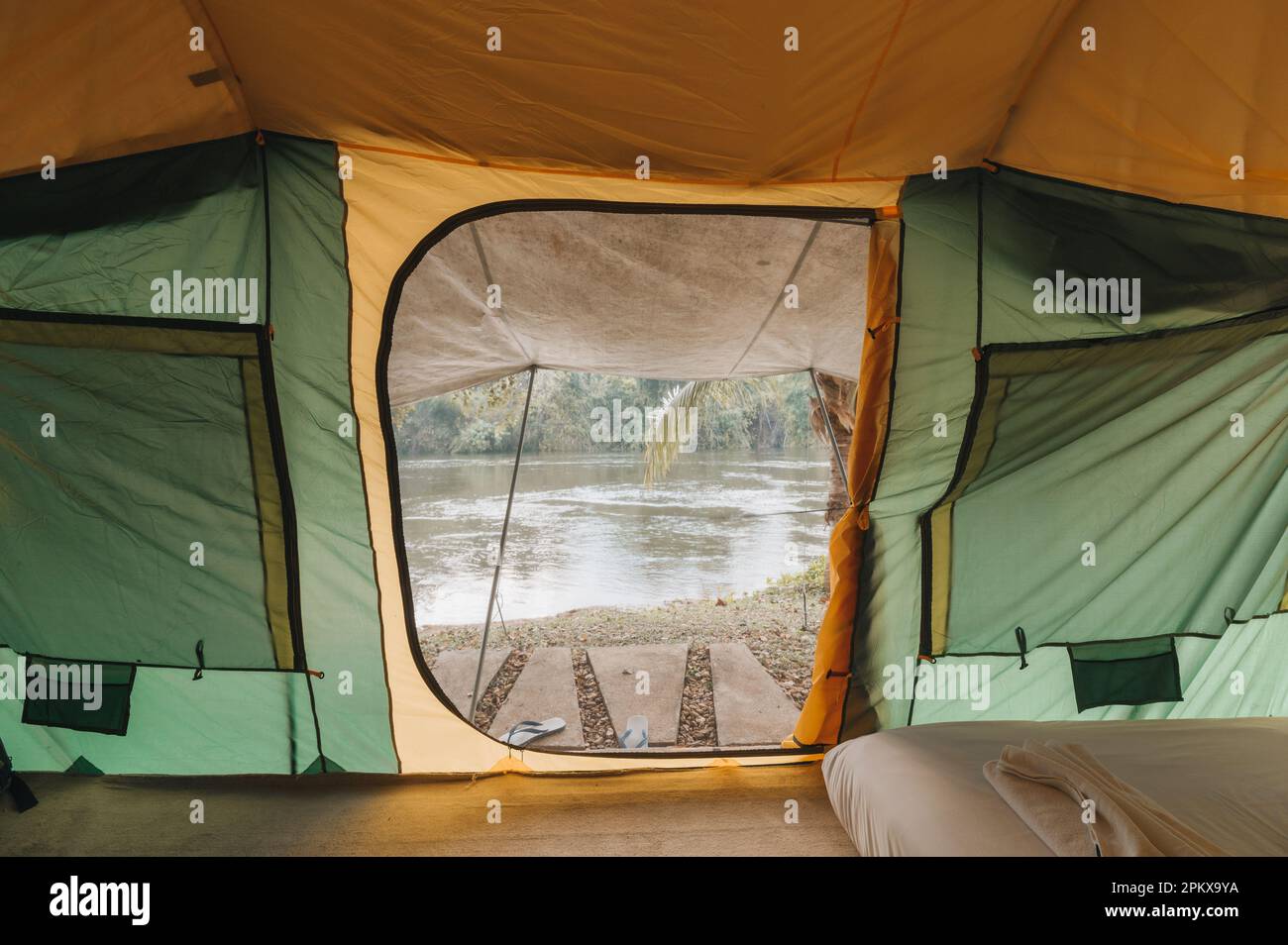 Inside of large comfortable camping tent on campground in the tropical ...