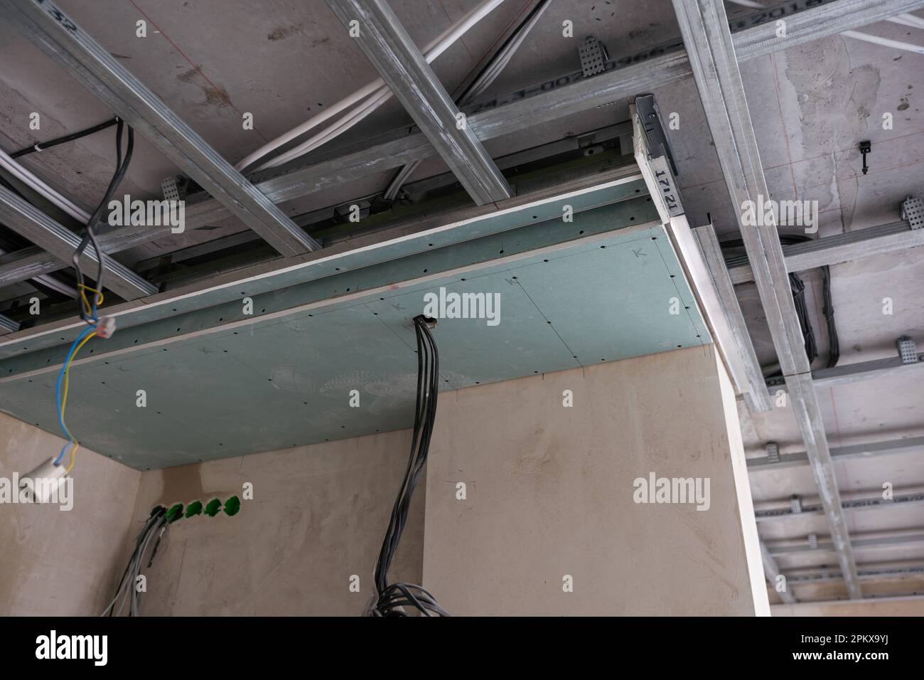 Man assembles profile metal frame for plasterboard ceilings Stock Photo ...