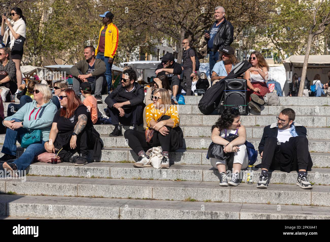 Barcelona, Spain - March 25 2023: People listen to the music of street ...