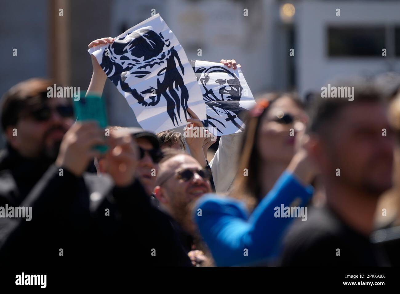 Youths show drawings of Pope Francis and Jesus Christ prior to the ...