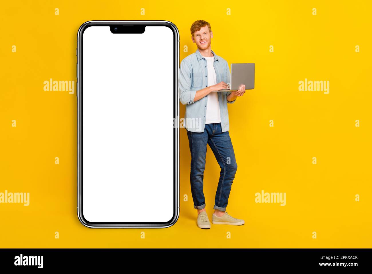 Full body size photo of young handsome guy programmer hold laptop ...