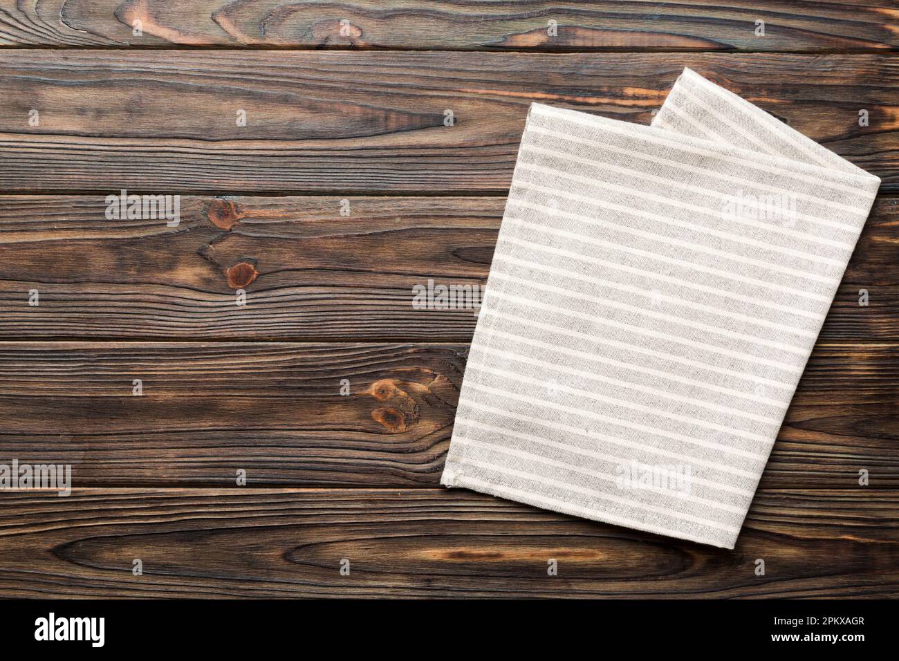 top view with gray kitchen napkin isolated on table background. Folded ...