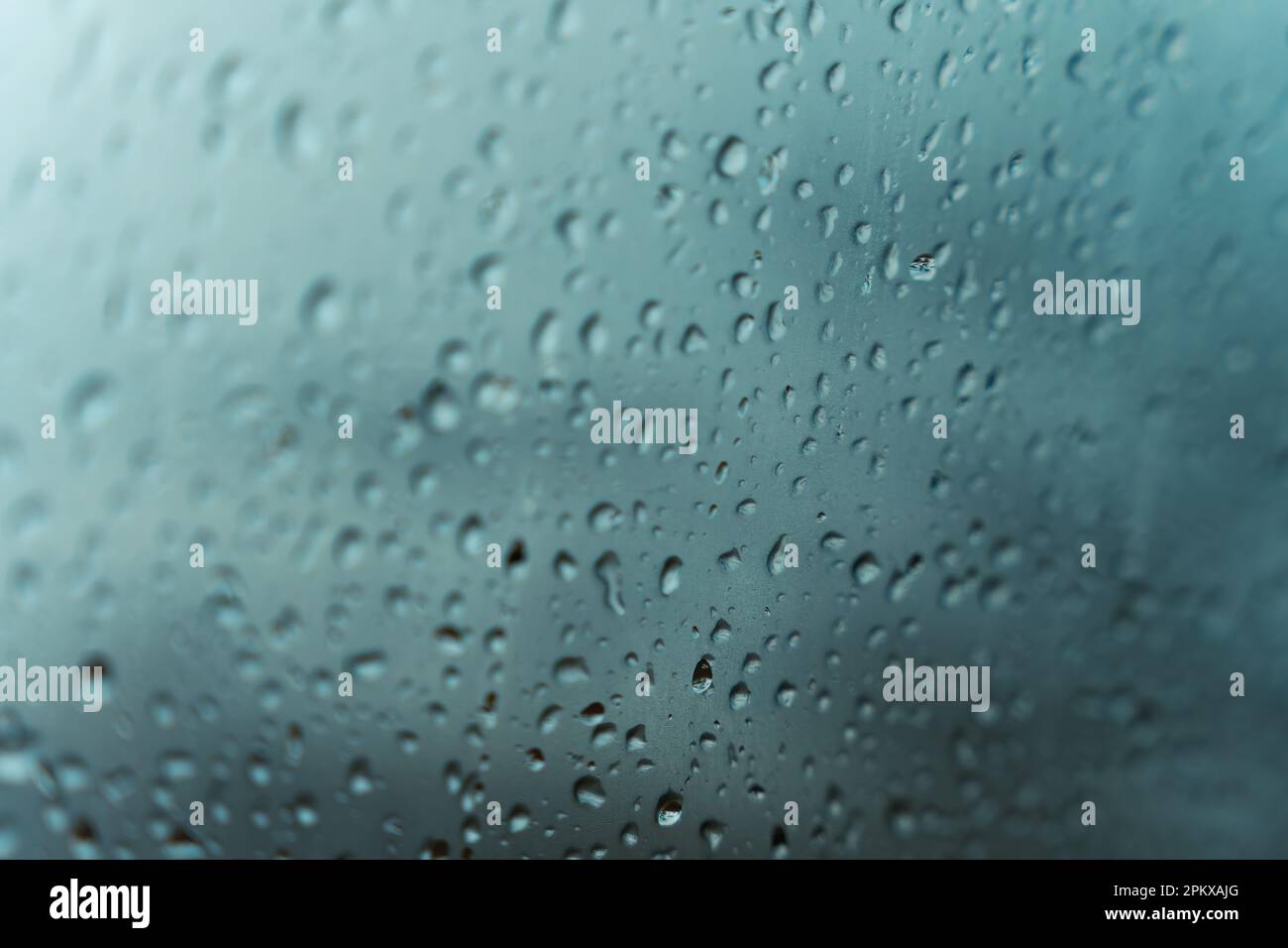 Rain water drops on the window in rainy season background. Depress and ...