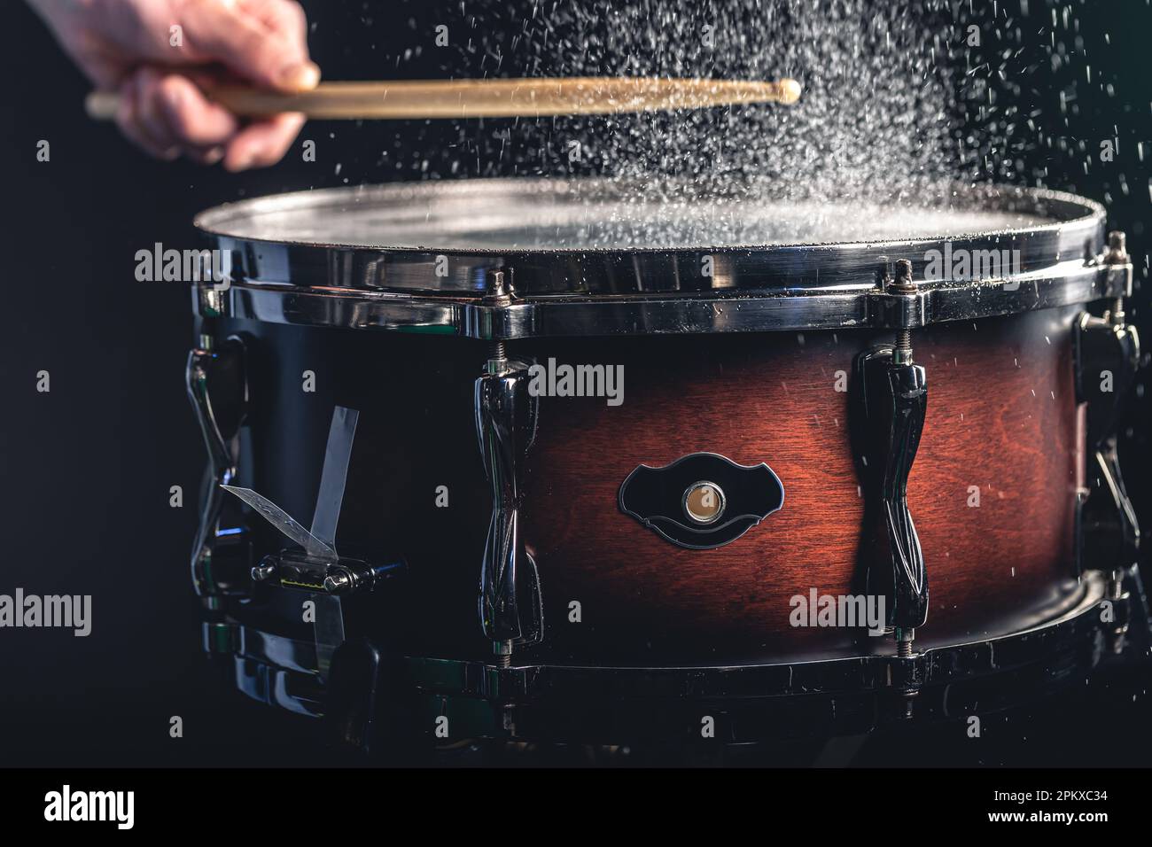 Drummer using drum sticks hitting snare drum with splashing water Stock ...