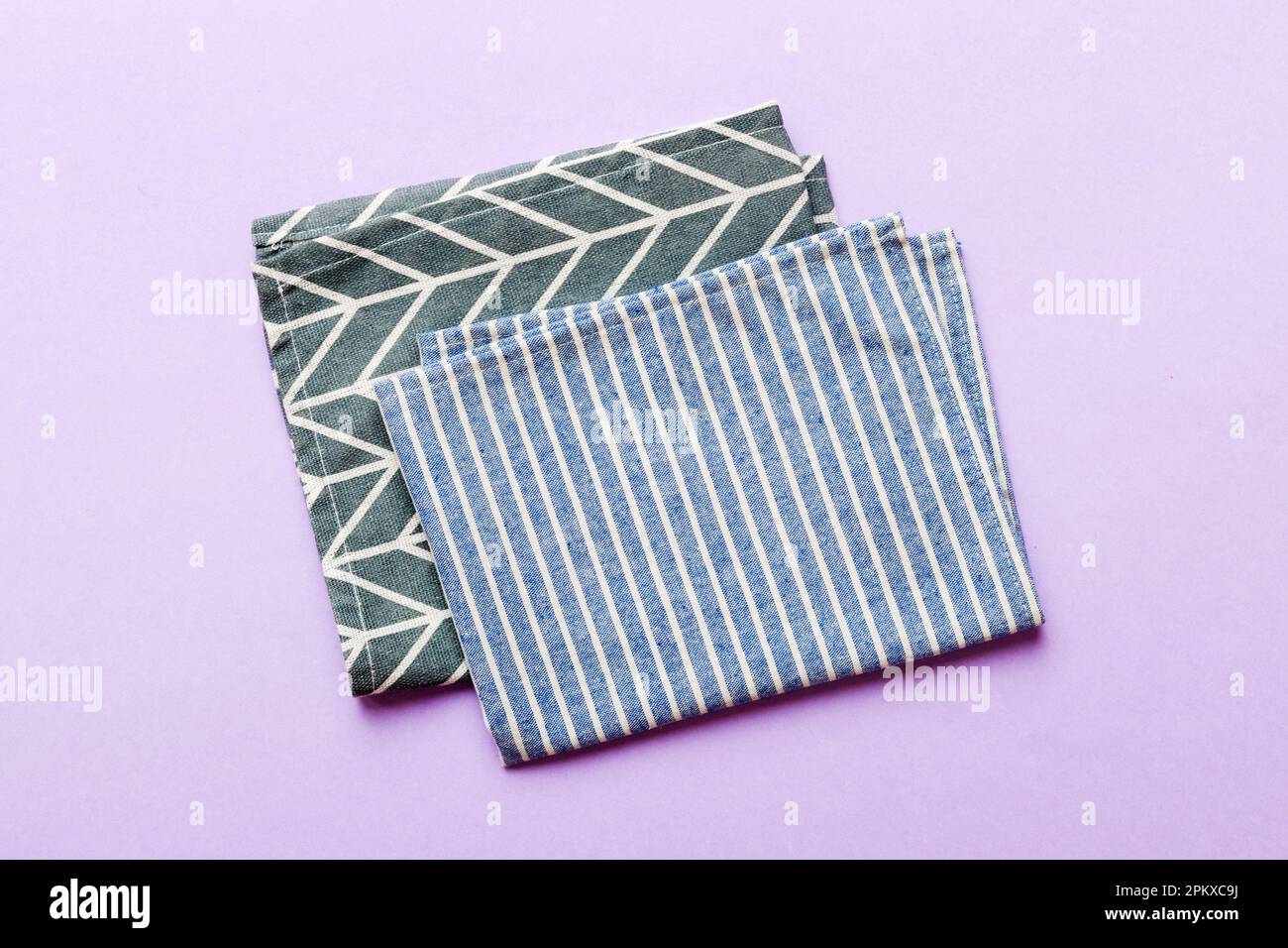 top view with blue kitchen napkin isolated on table background. Folded ...