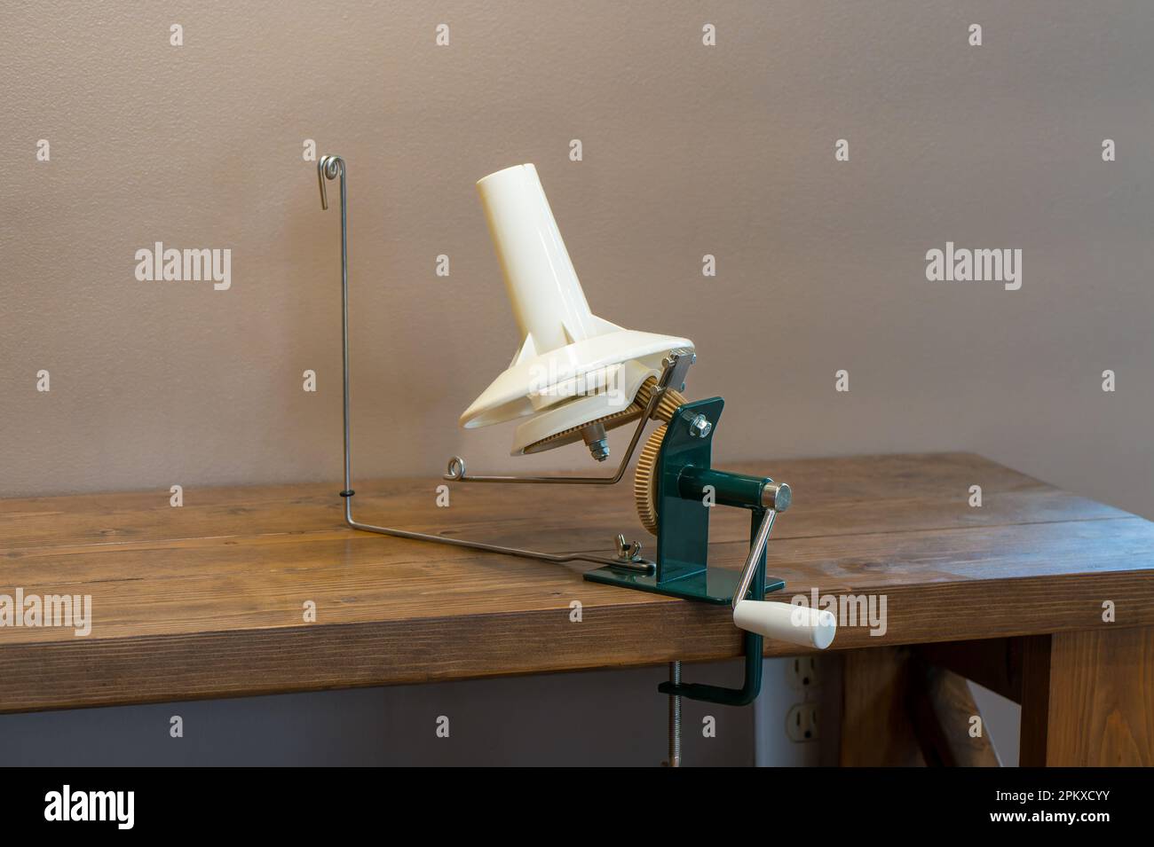 Mechanical yarn winder or reel used in knitting attached to a tabletop ...