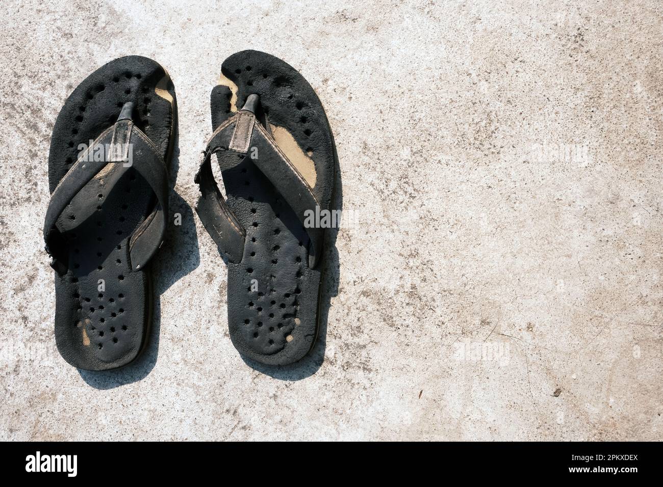Slippers - very old and damaged Stock Photo - Alamy