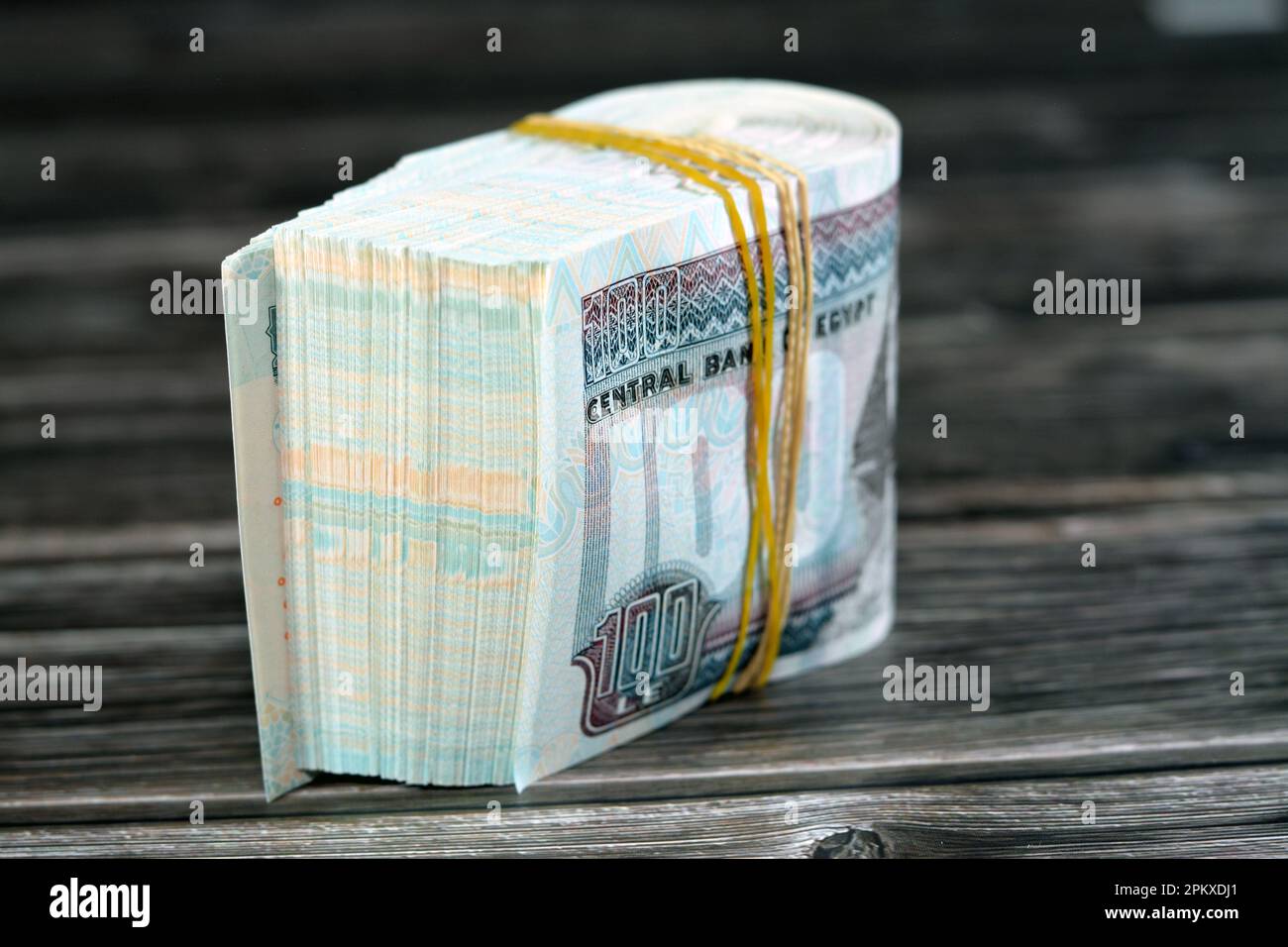 Folded 100 EGP LE one hundred Egyptian pounds cash money bills rolled ...