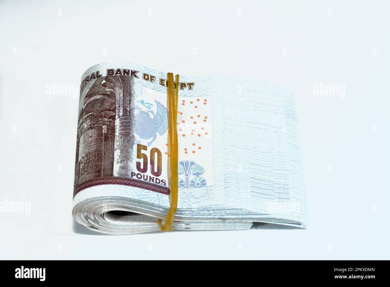 Folded 50 EGP LE fifty Egyptian pounds cash money bills rolled with ...