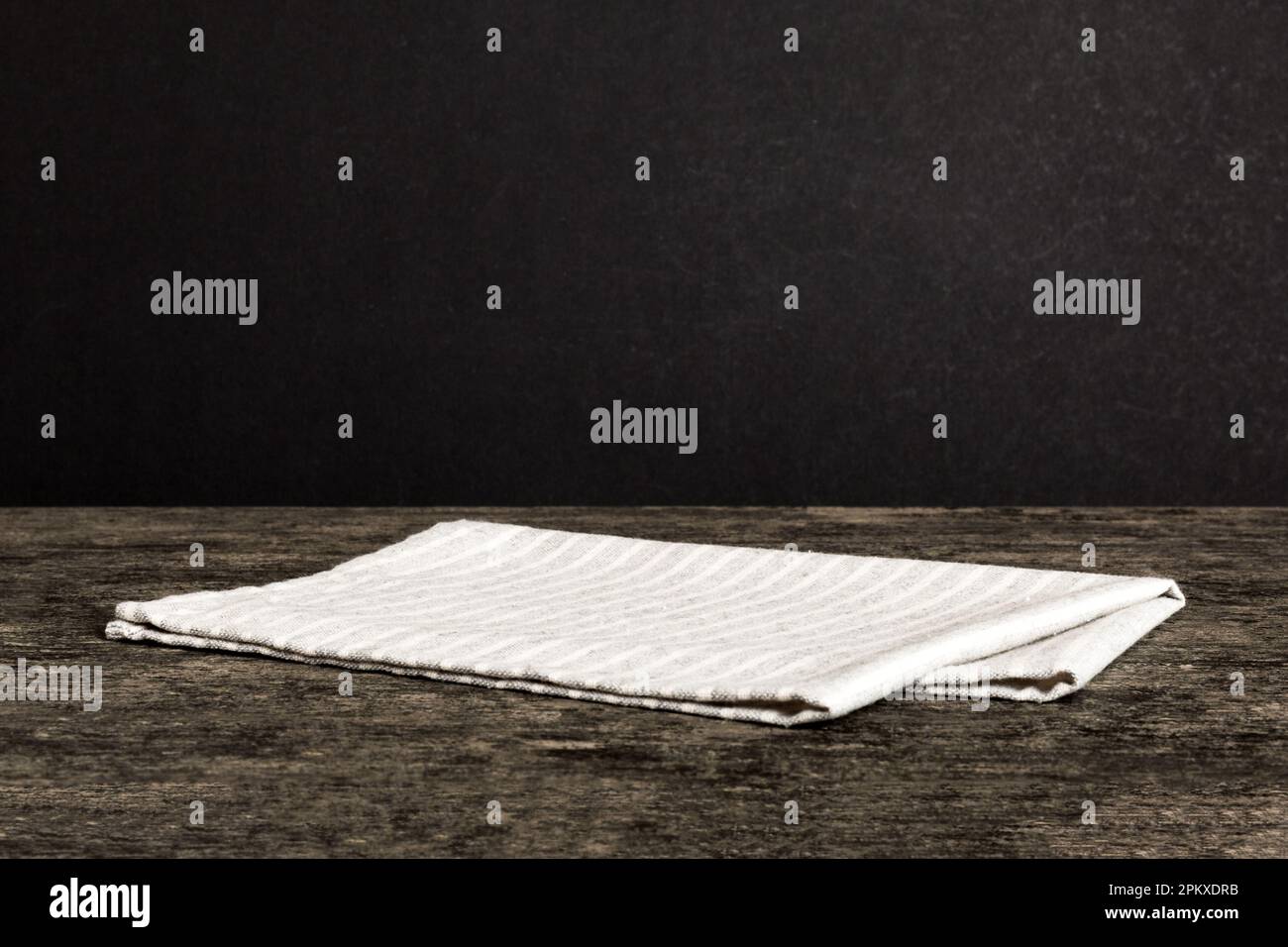 top view with gray kitchen napkin isolated on table background. Folded ...