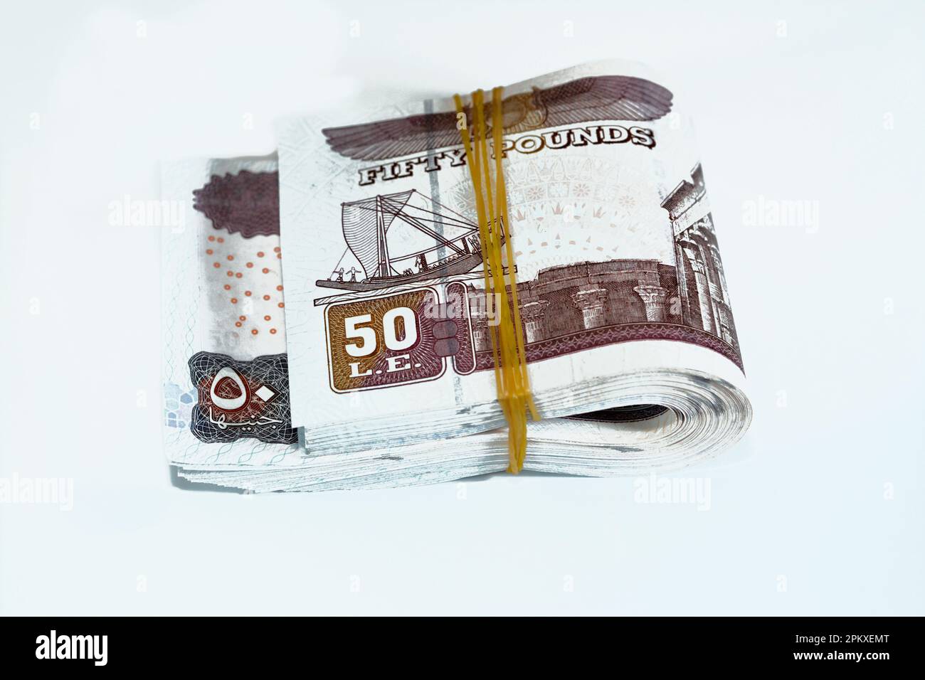 Folded 50 EGP LE fifty Egyptian pounds cash money bills rolled with ...