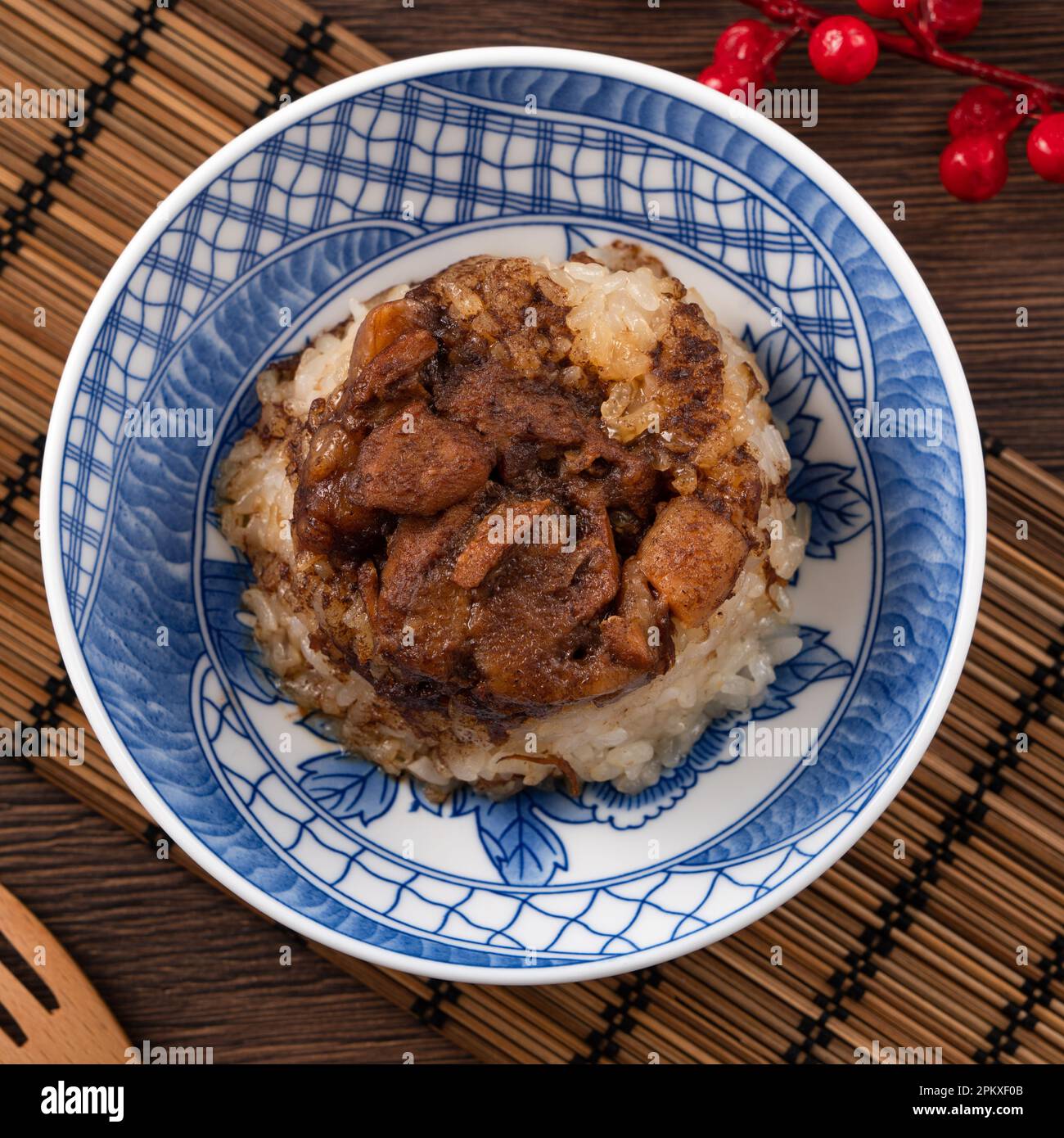 Migao, tube rice cake, rice pudding in a bowl topped with minced pork ...
