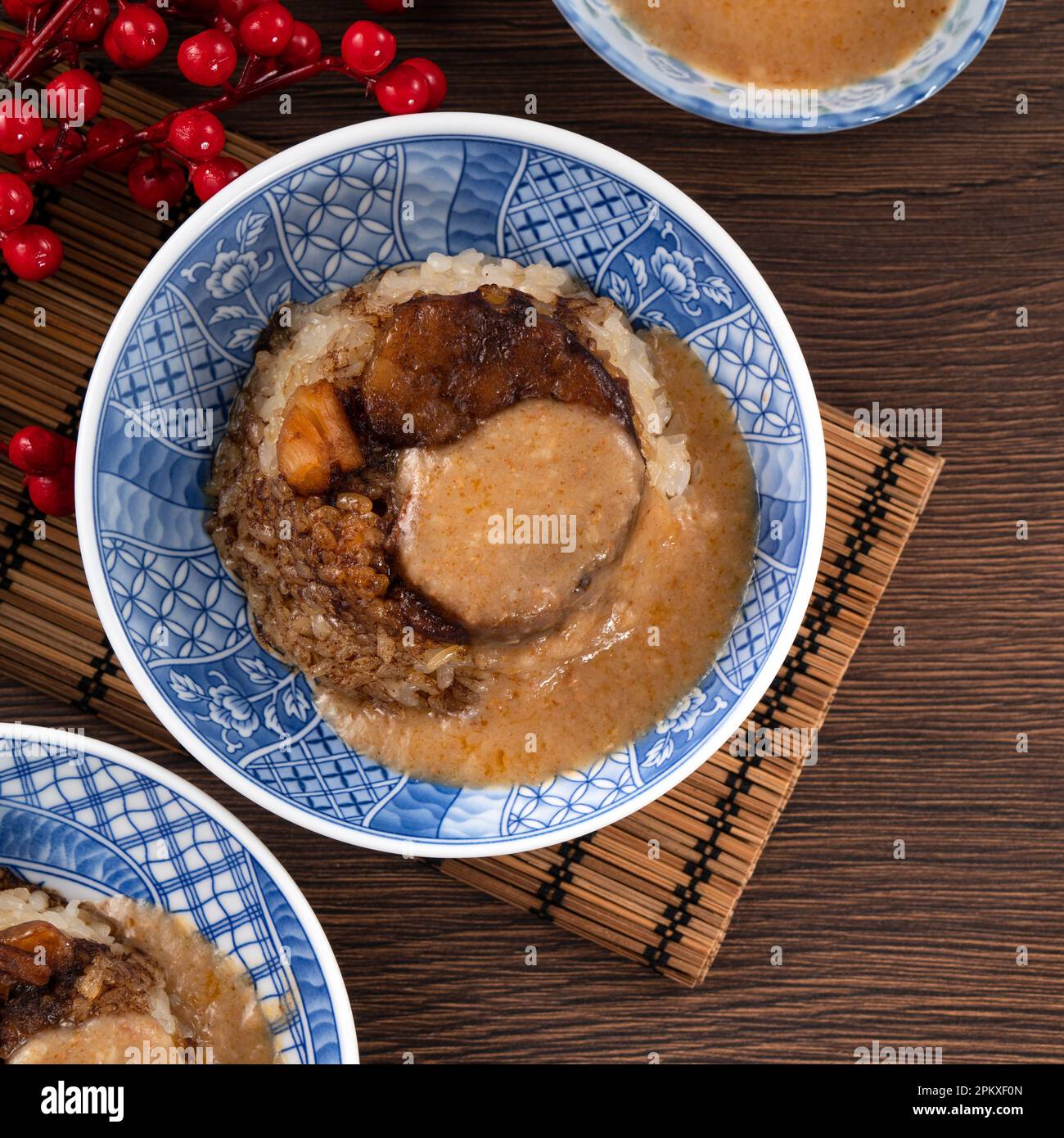 Migao, tube rice cake, rice pudding in a bowl topped with minced pork ...