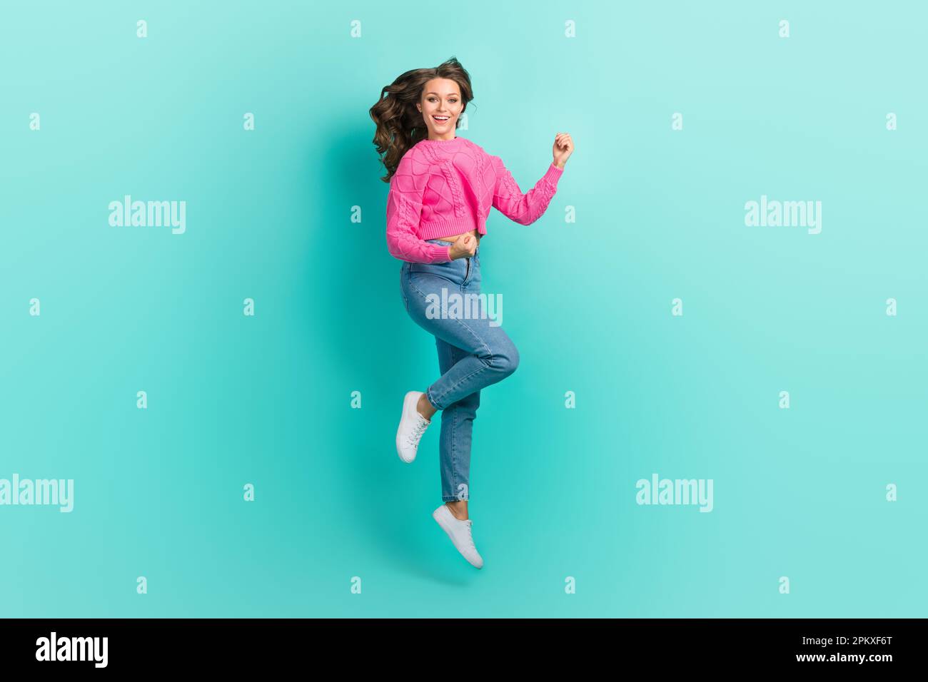 Full Length Photo Of Cheerful Lucky Girl Wear Pink Sweater Jumping High