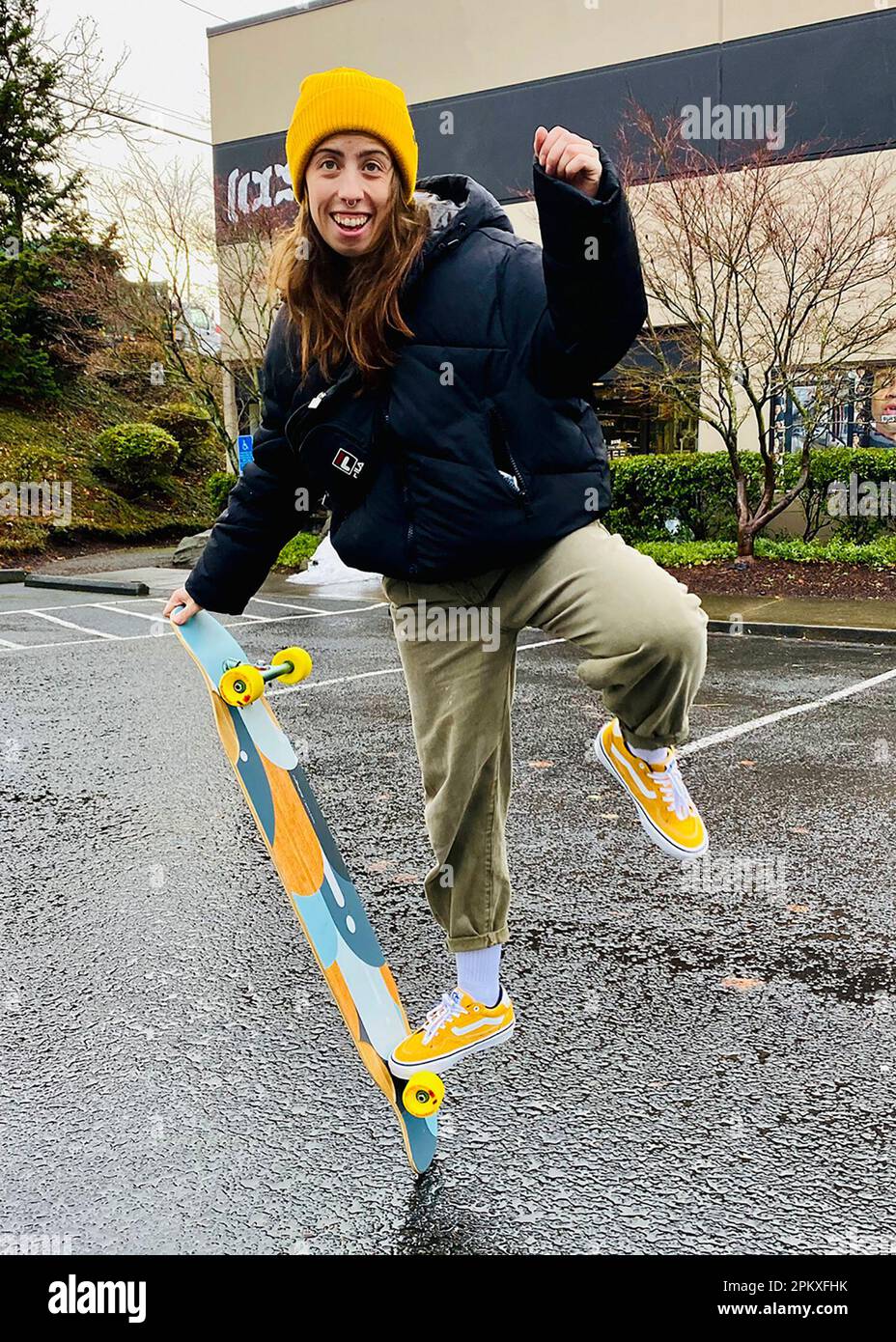 Hannah Dooling poses with her longboard outside Daddies Board Shop in ...