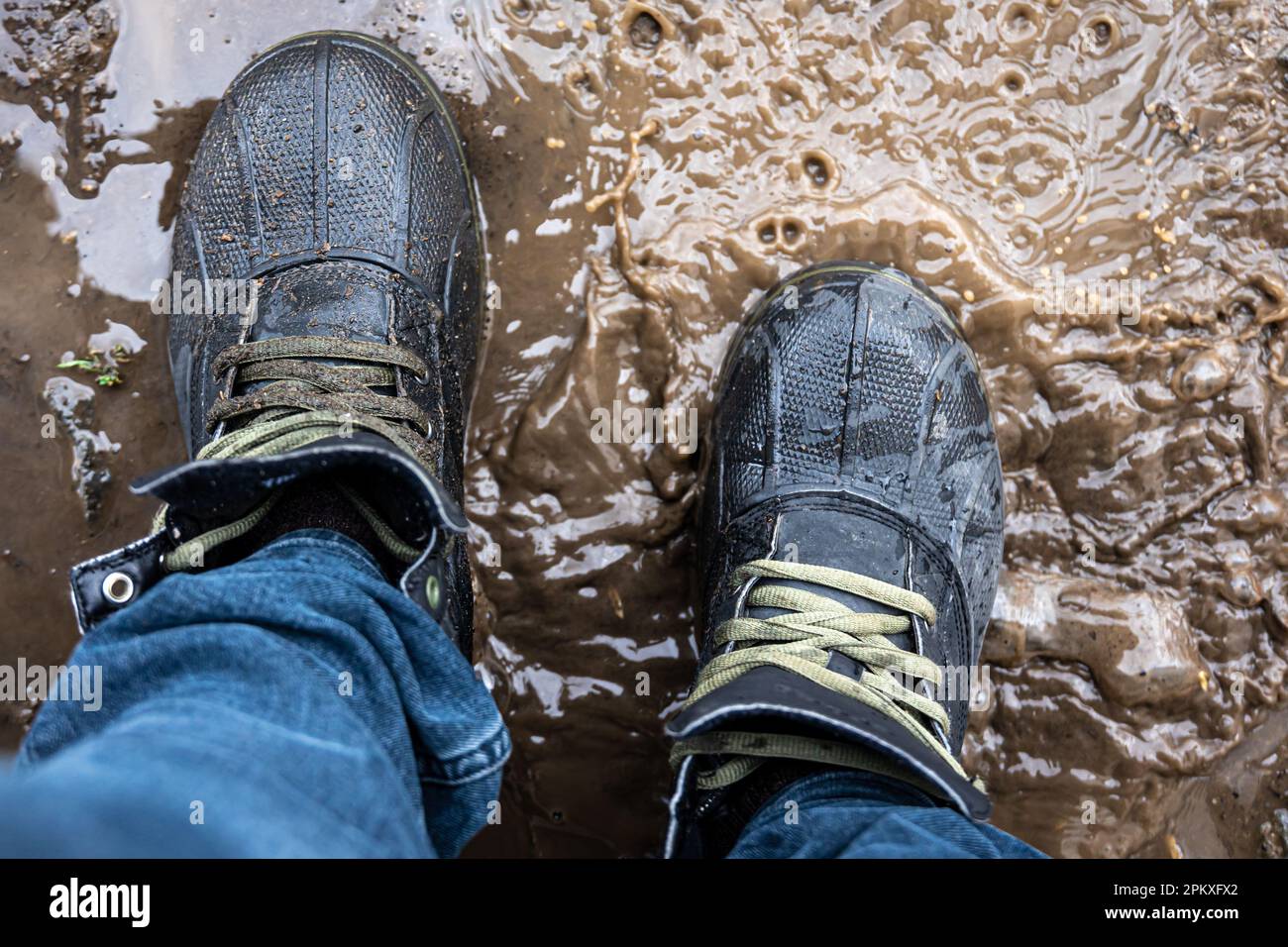 View from above on pair of trekking shoes in a mud Stock Photo - Alamy