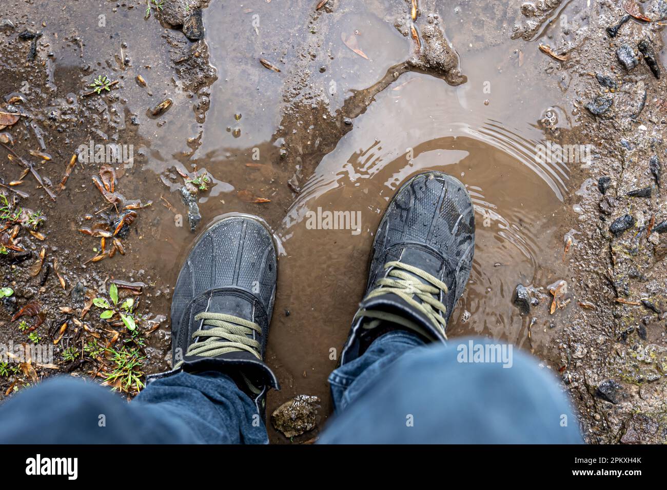 Pair of sneakers in mud hi-res stock photography and images - Alamy