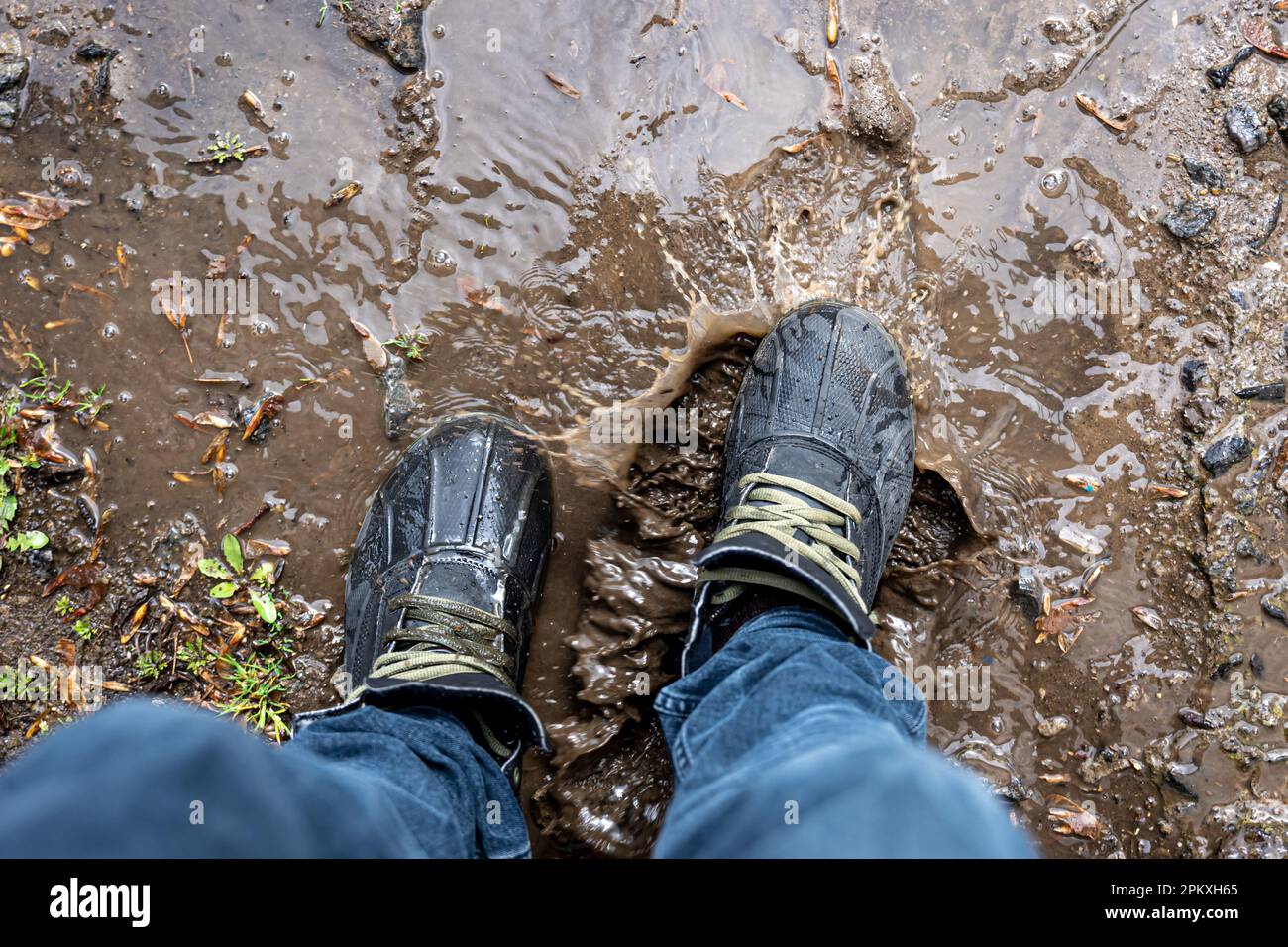 Pair of sneakers in mud hi-res stock photography and images - Alamy