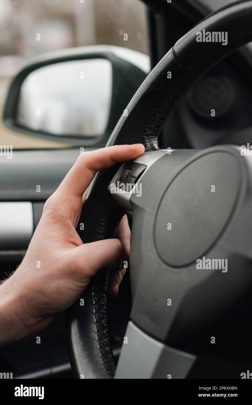 Drivers's hands on a left stearing,steering wheel of a car Stock Photo ...