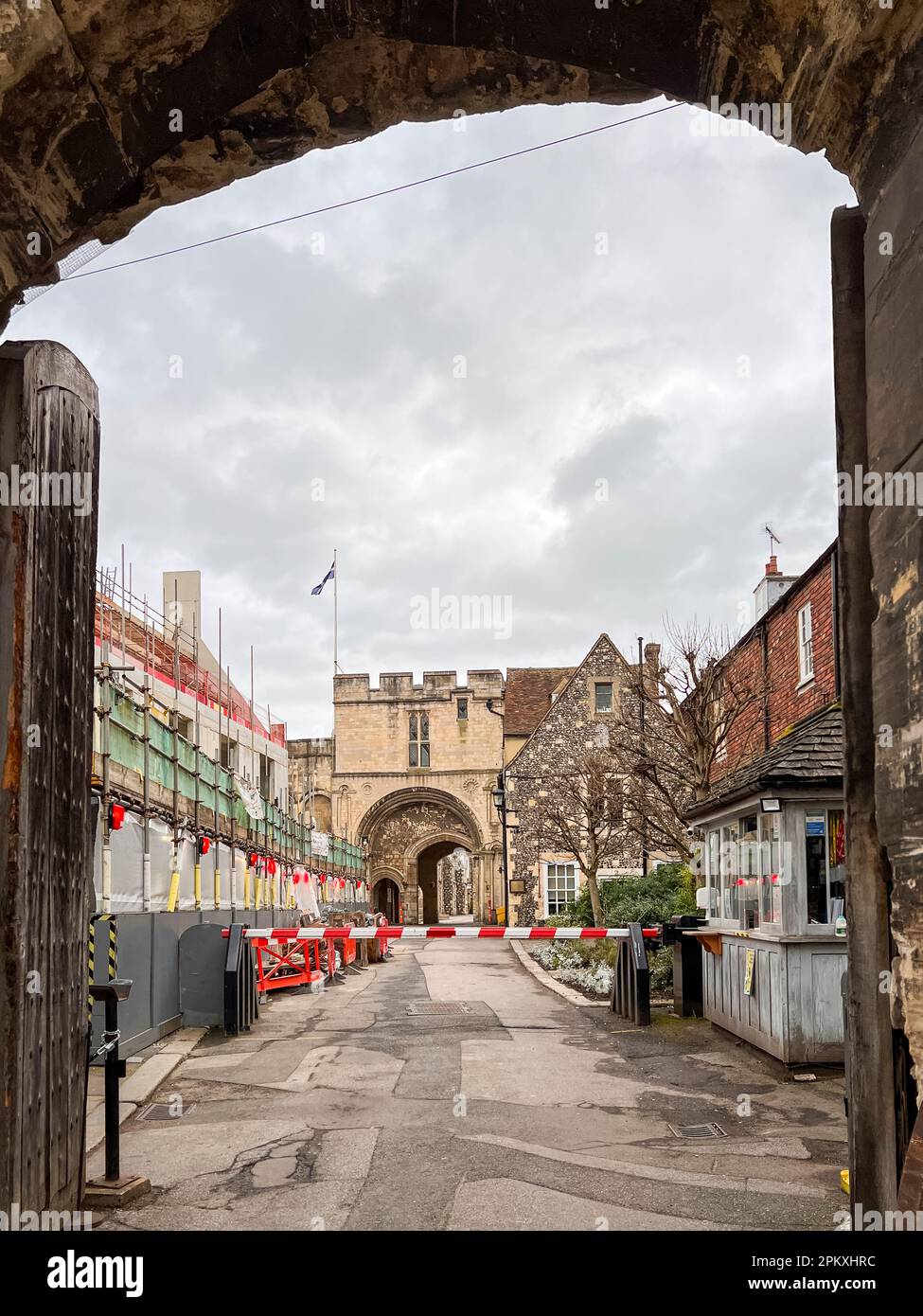 Ancient stone gateway and flint buildng in the city of Canterbury, Kent ...