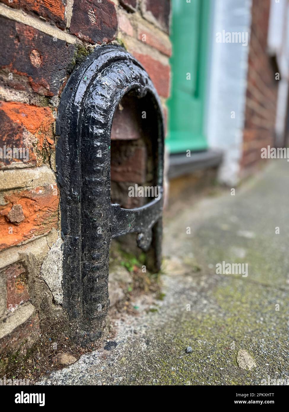 Ancient boot scraper built into a brick wall, Kent, UK Stock Photo - Alamy