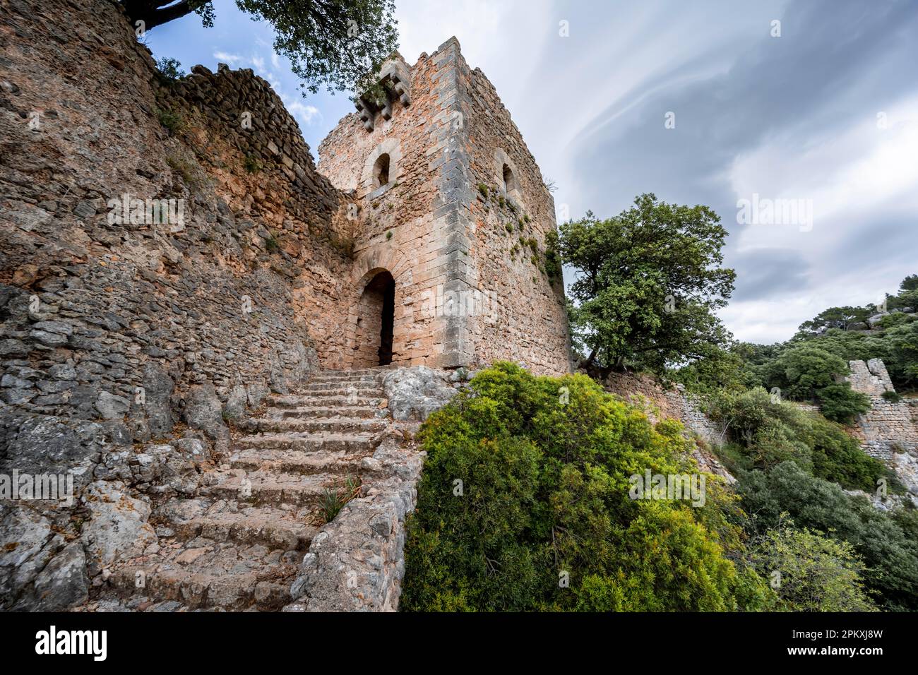 Stone steps and tower of the castle ruins Castell Alaro, Serra de ...