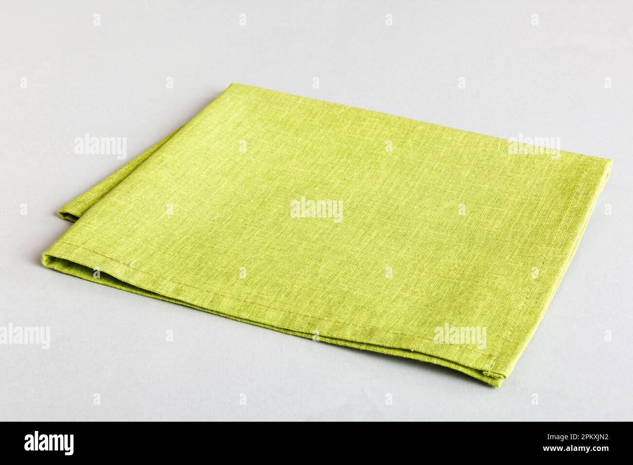 top view with green kitchen napkin isolated on table background. Folded ...