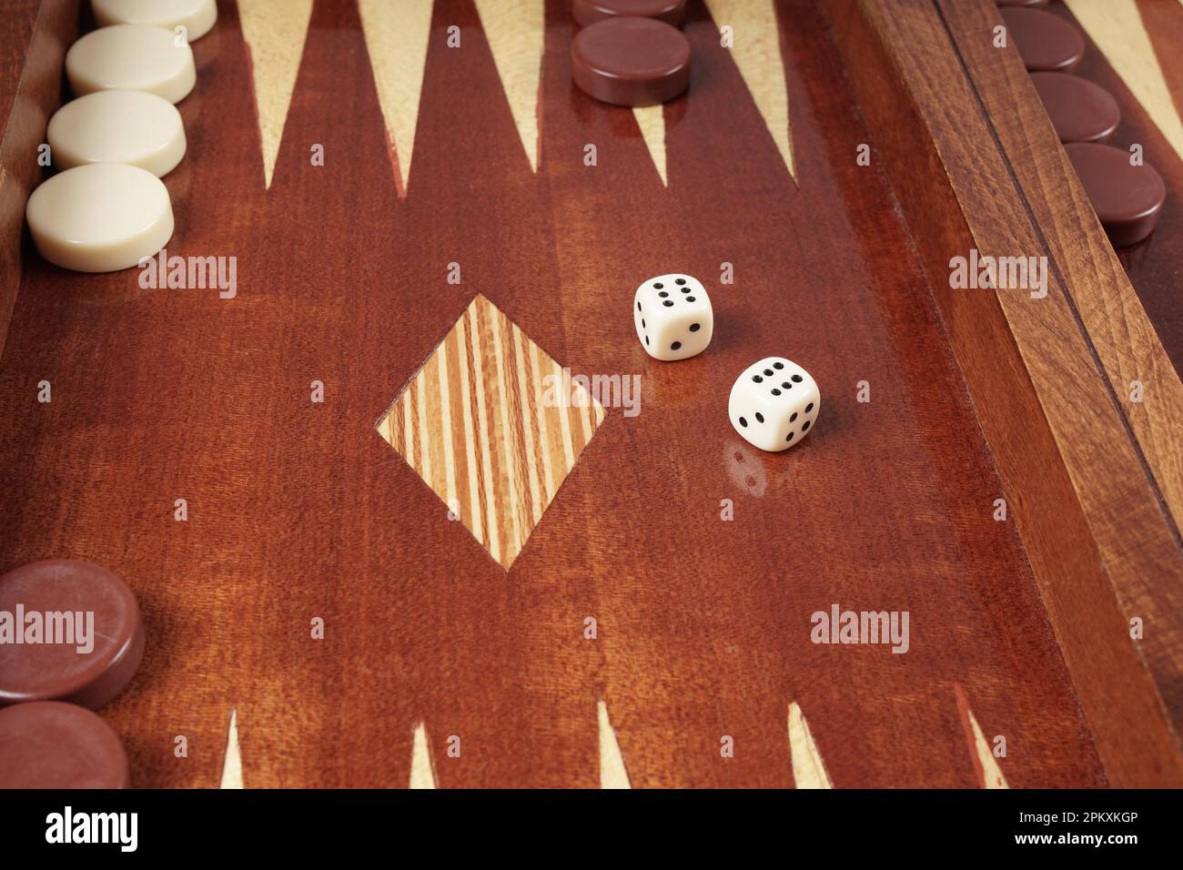 double six or boxcars, rolling dice on backgammon board game Stock ...