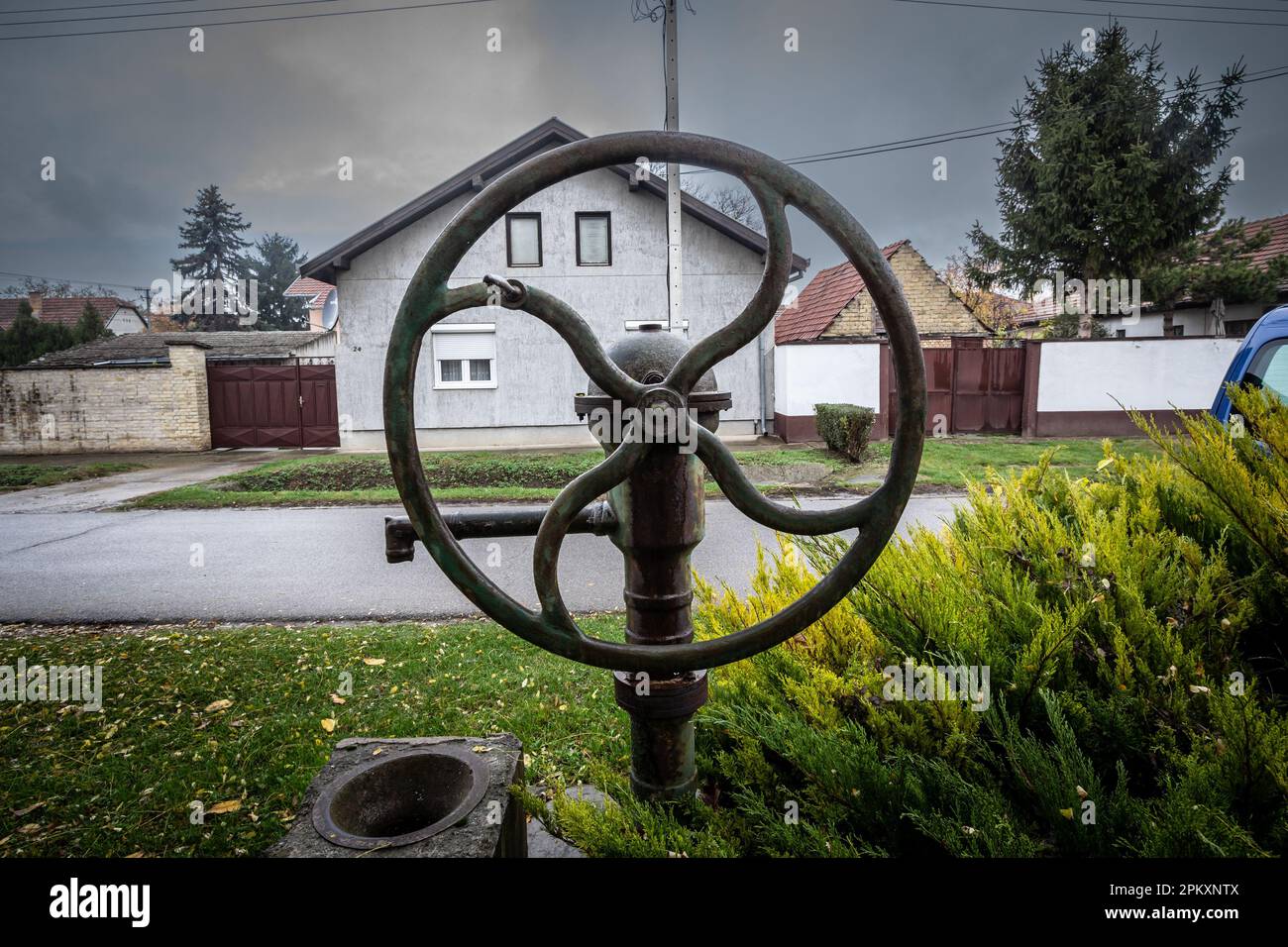 Picture of an old decaying rusty water pump, a vintage communal water ...