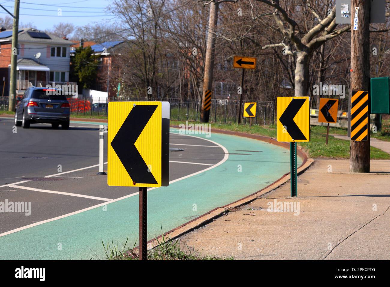 Left Chevron Arrow traffic signs warn drivers of a sudden curve in the ...