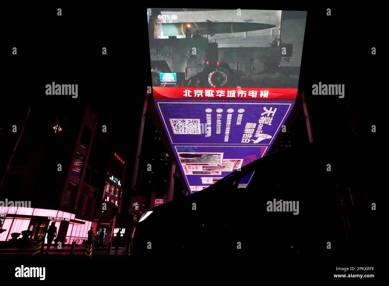 An outdoor screen shows the recently concluded Joint Sword exercise ...