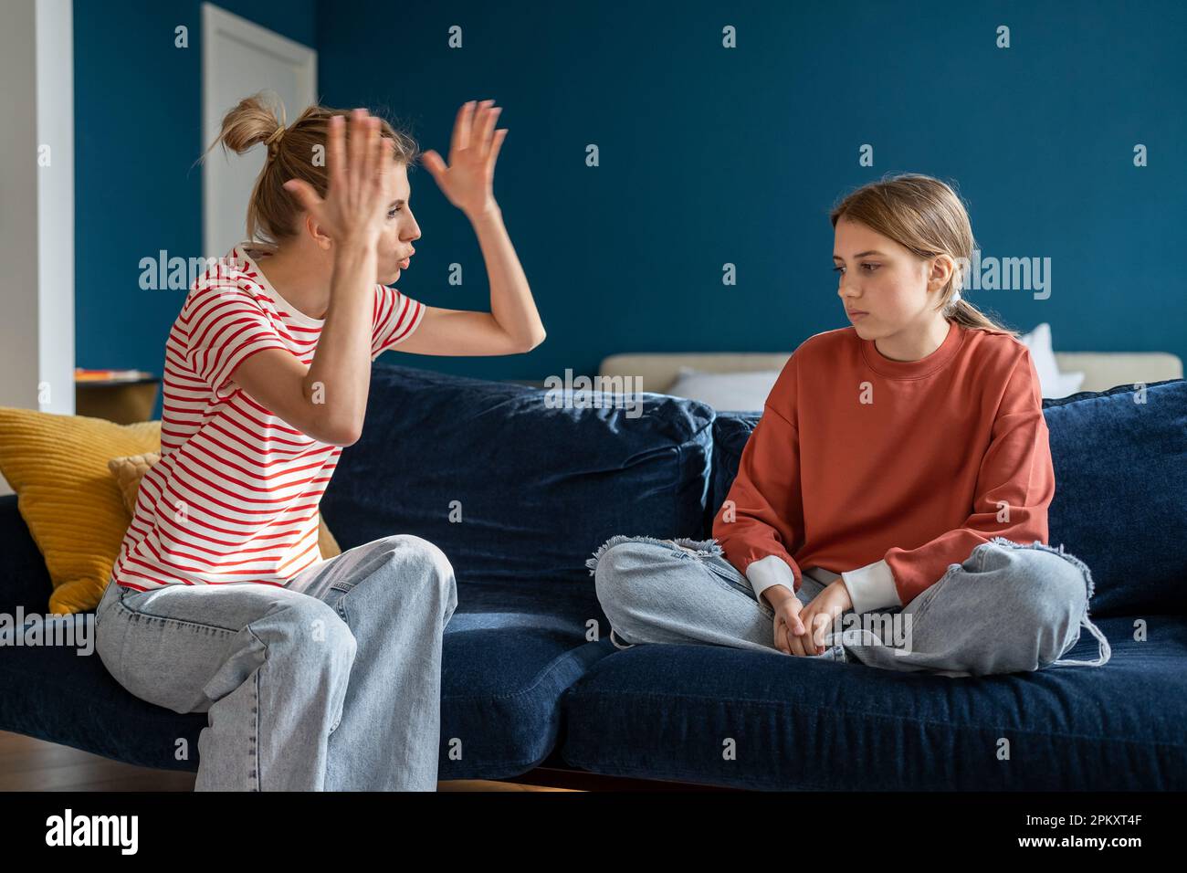 Young angry emotional mother screaming at troubled teen daughter at ...