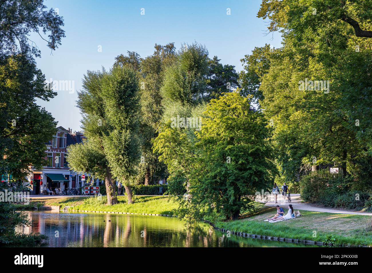 Groningen, The Netherlands - August 12, 2022: People relaxing in public park Noorderplantsoen in ...