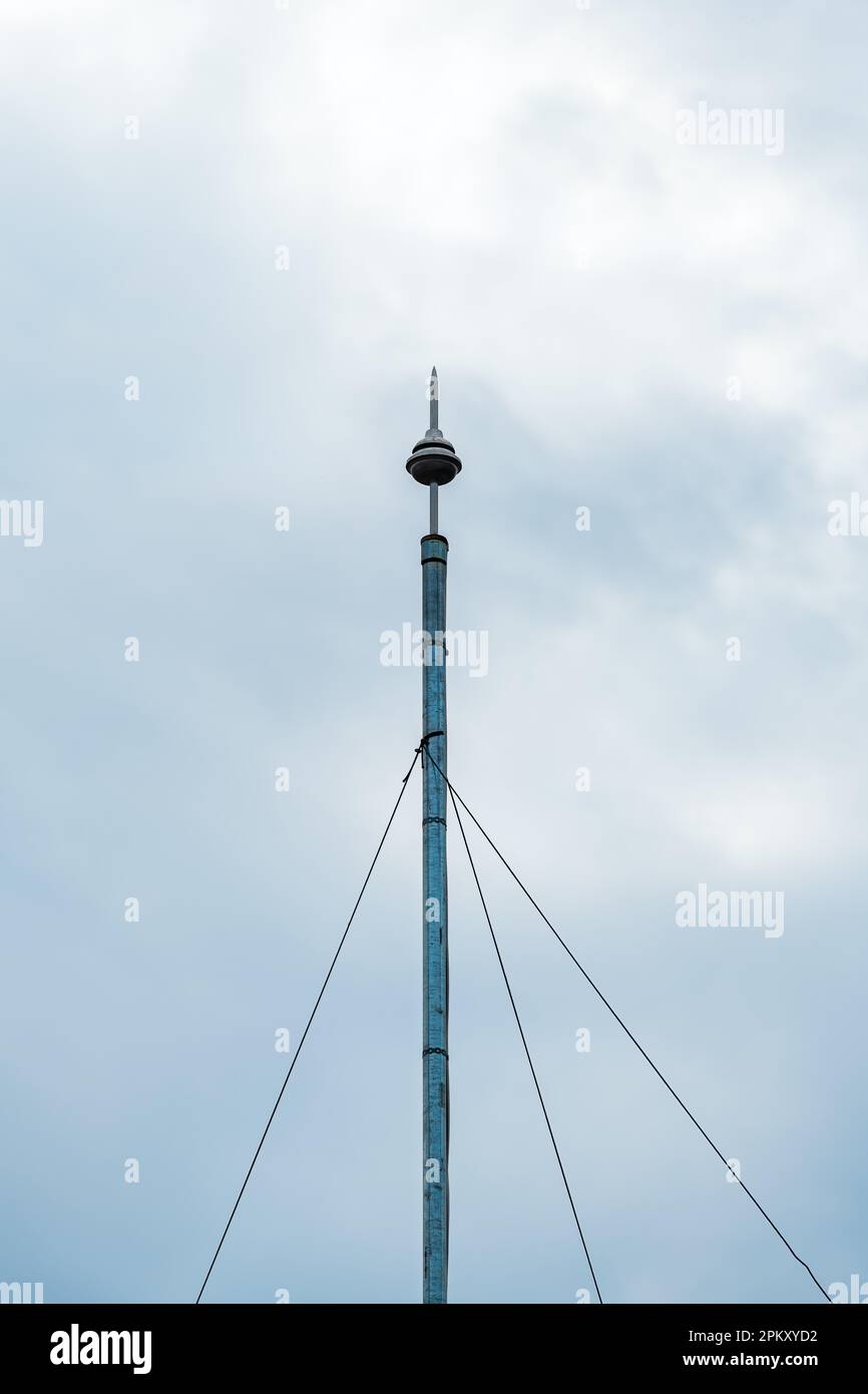 Radioactive lightning interception rod against dark stormy sky ...