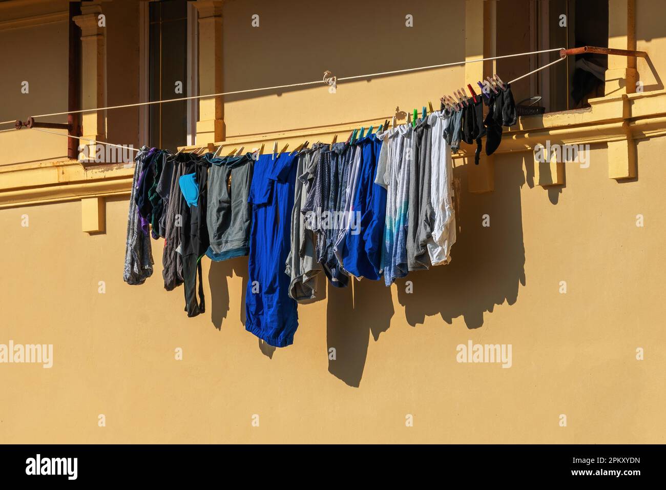 Old clothes drying on the rope between two windows of an old istrian ...