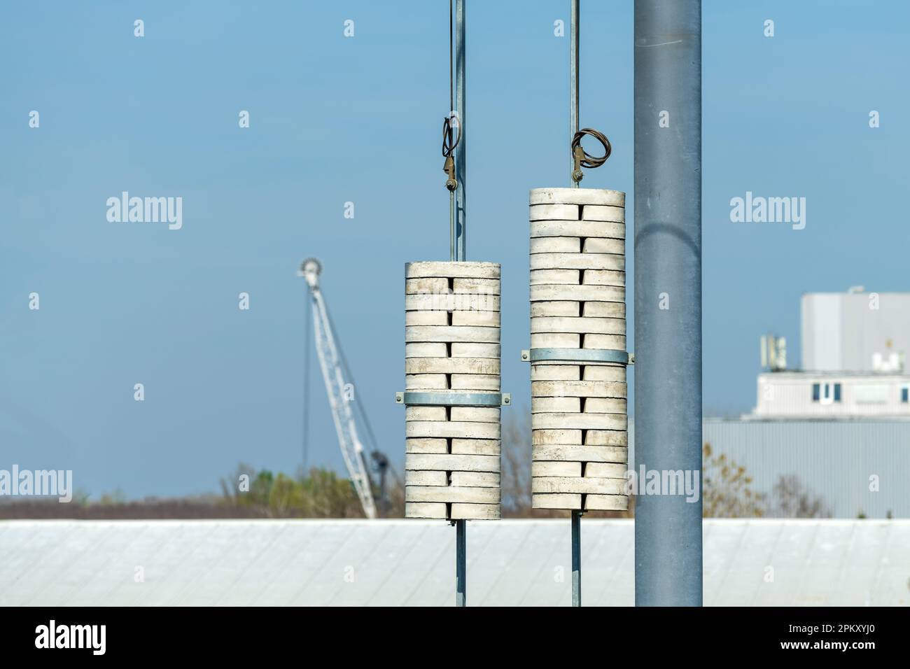 Electric train railway line tension pole with wires and concrete ...