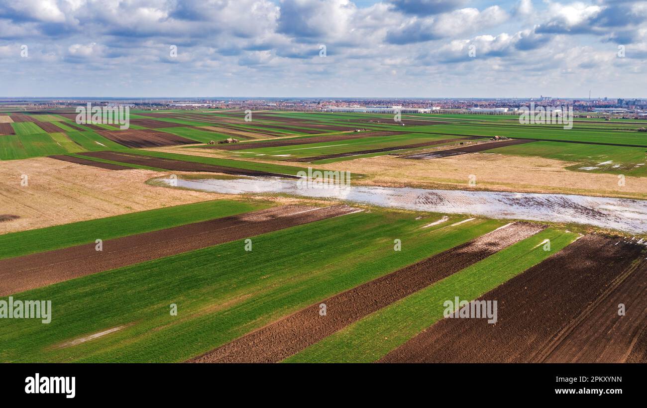 Flooded agricultural fields in spring, aerial view from drone pov ...
