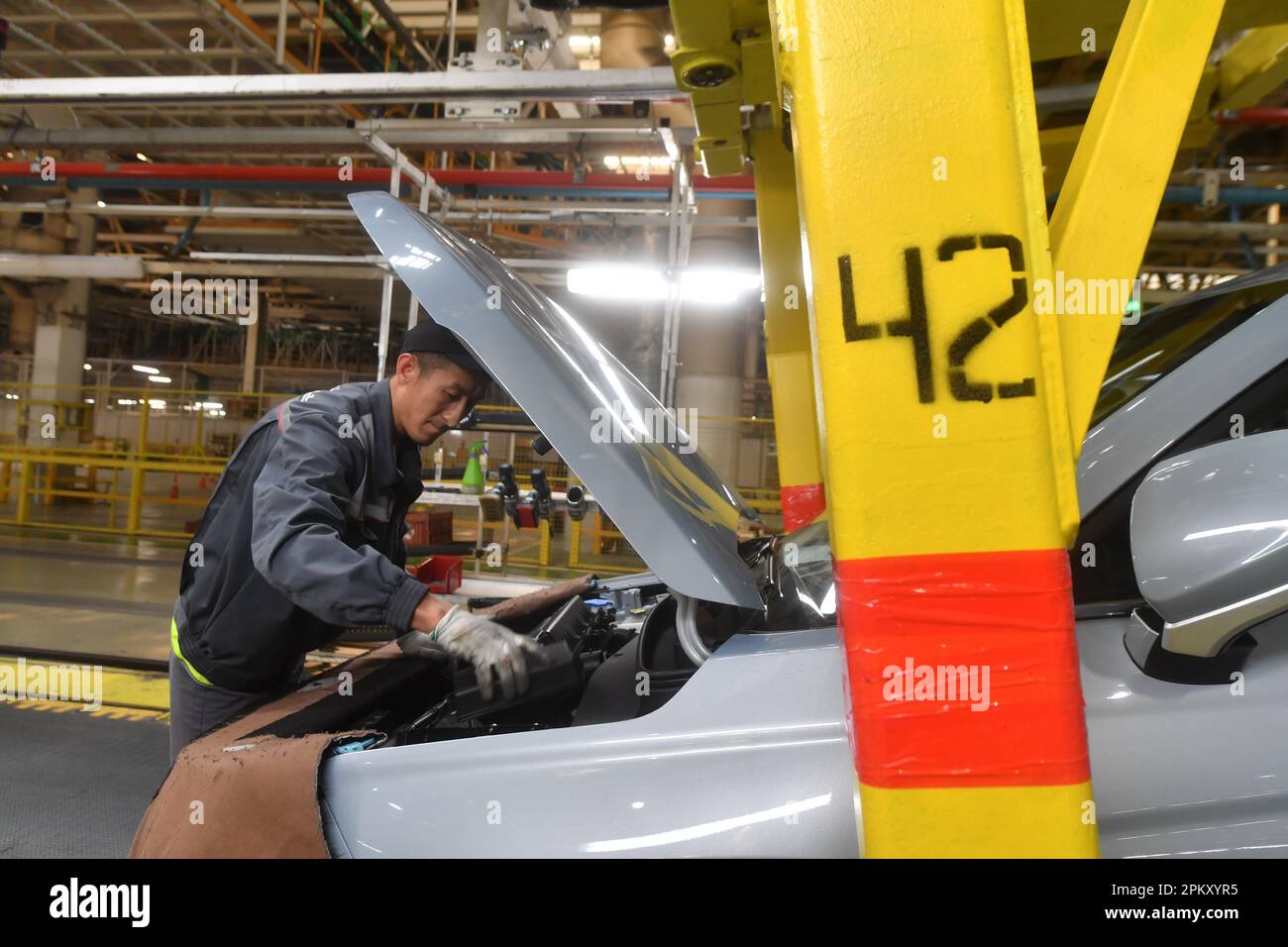 Moscow. Workers assembling a car on the production line of the Moscow ...