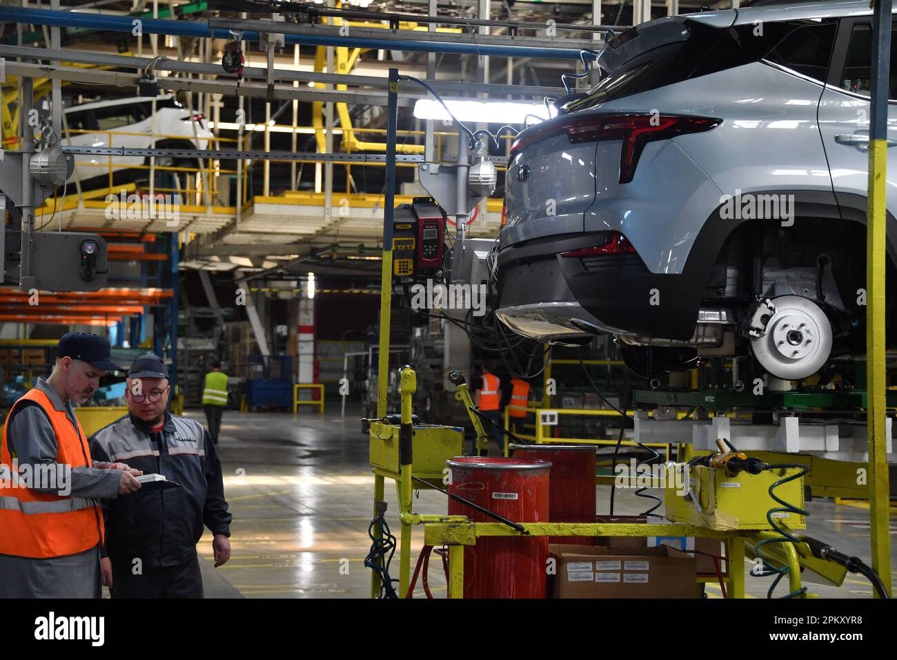 Moscow. Workers assembling a car on the production line of the Moscow ...