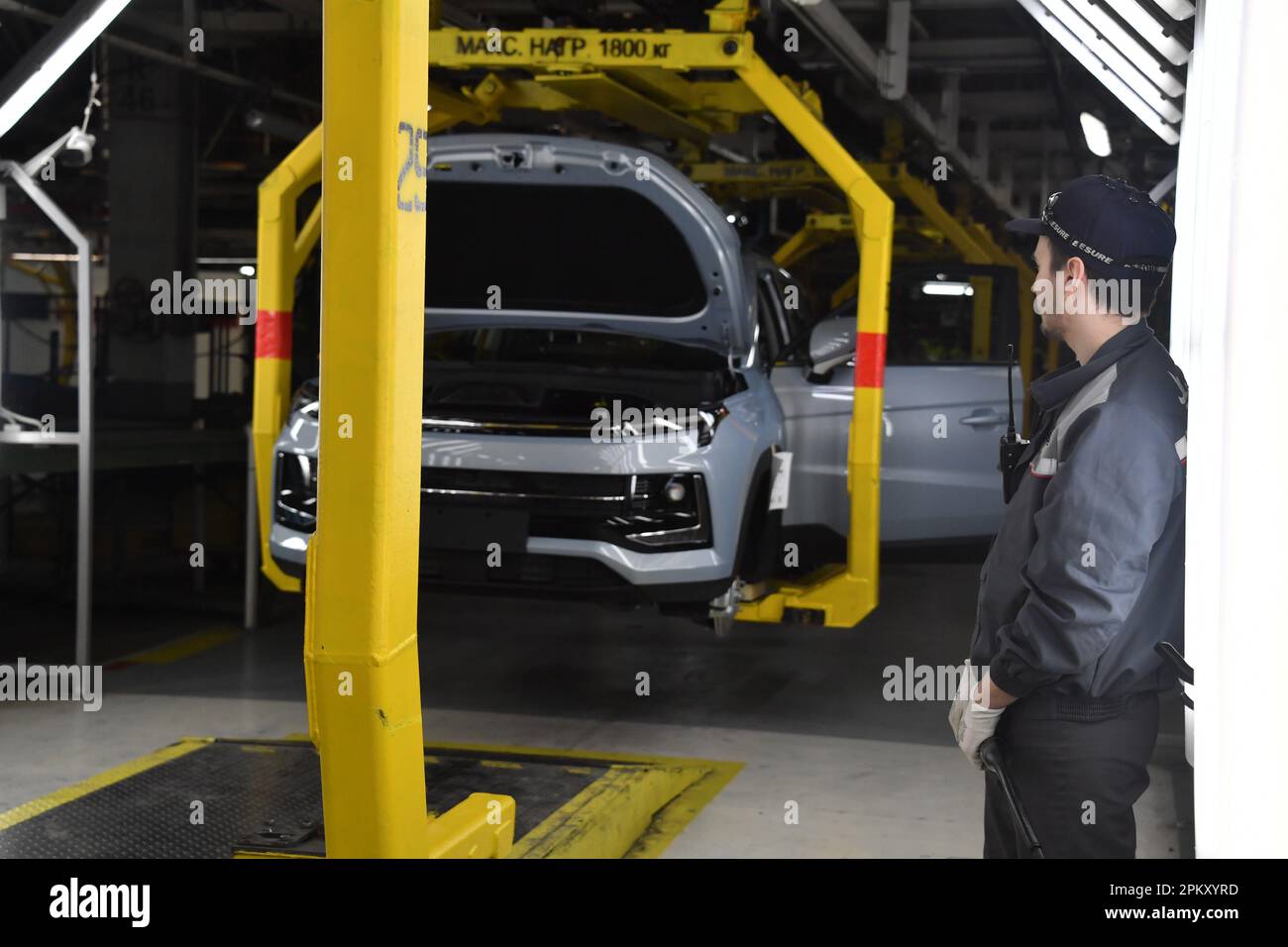 Moscow. A worker assembling a car on the production line of the Moscow ...