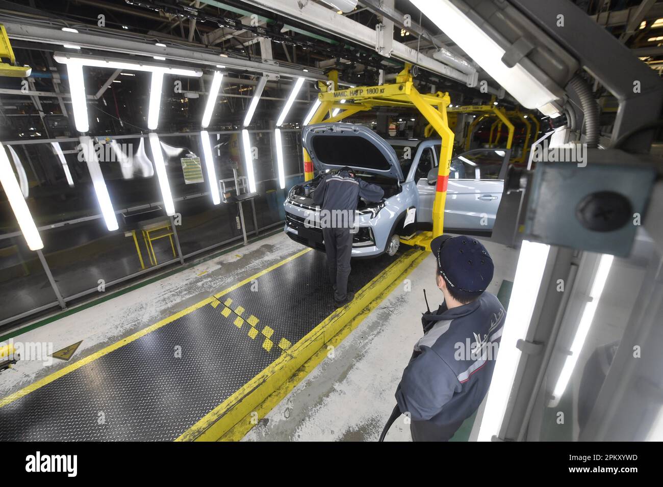 Moscow. Workers assembling a car on the production line of the Moscow ...