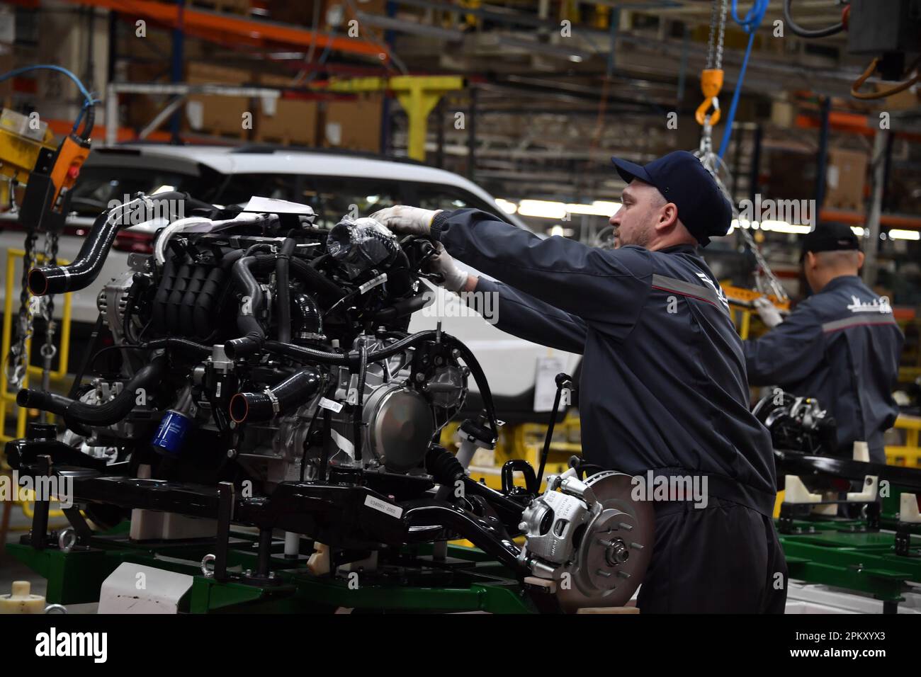 Moscow. A worker assembling a car on the production line of the Moscow ...