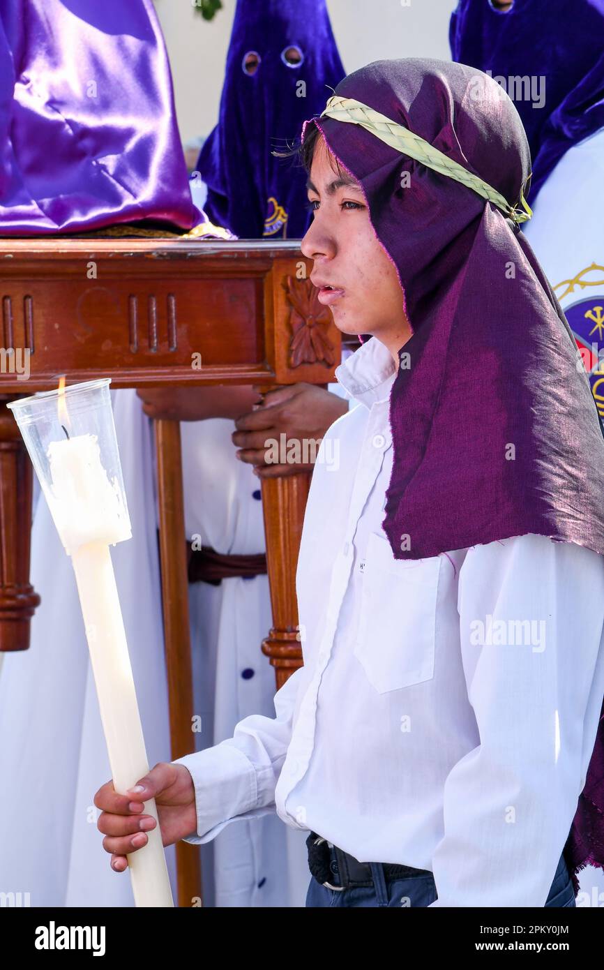 Young mexican holding a candle during Good Friday procession, City of ...