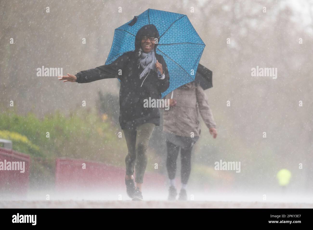 People brave the rainy conditions in Battersea Park, London, on Easter ...