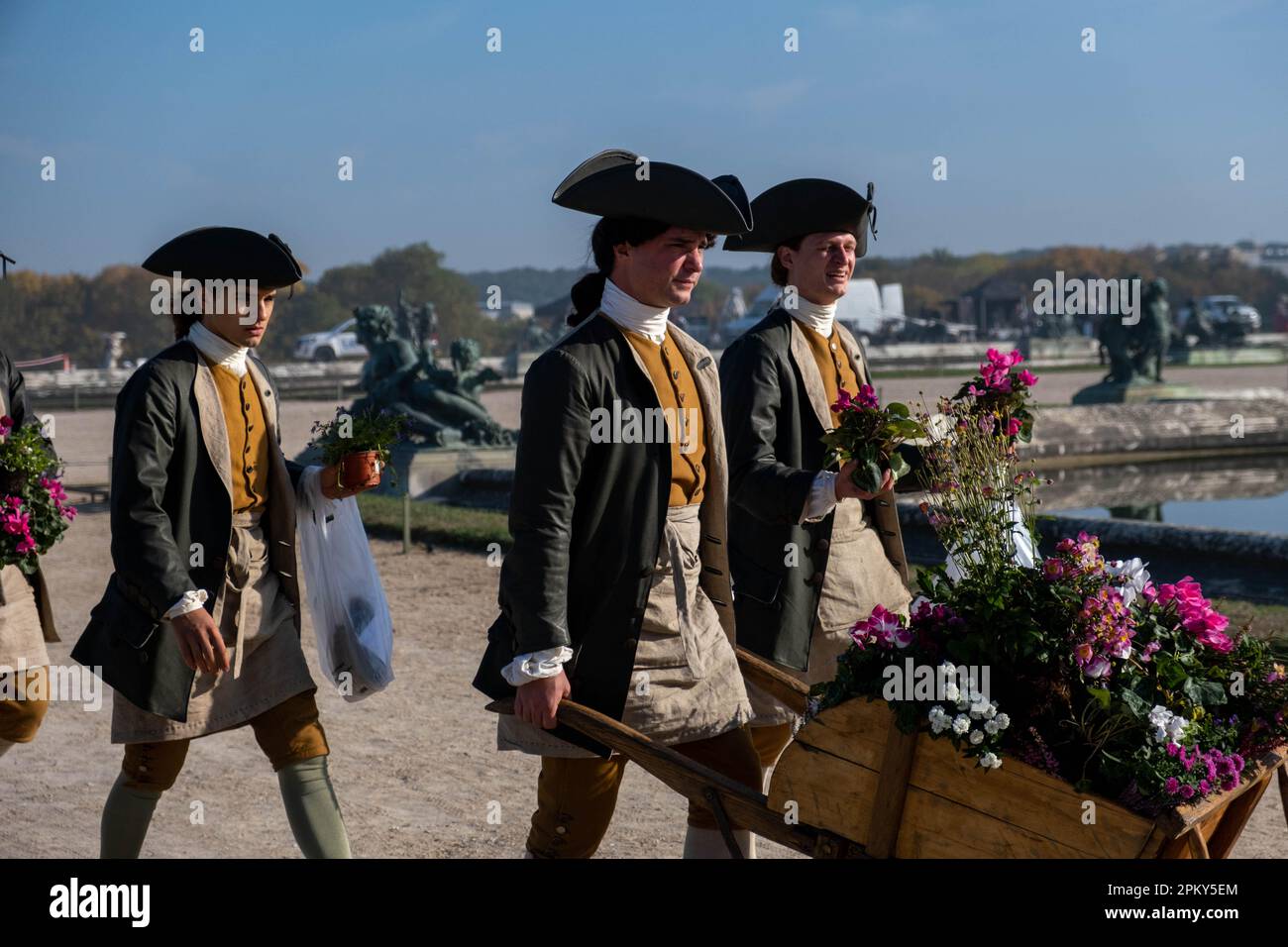 Victorian Era France: Male Servants in Elegant Attire Holding Flowers ...